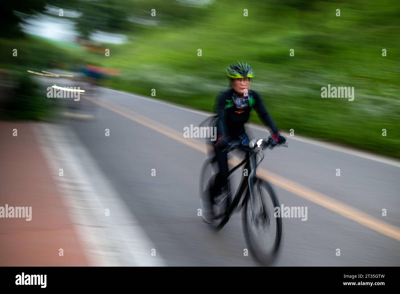 Intentional camera movement blur of speeding cyclist on Hangang Han ...