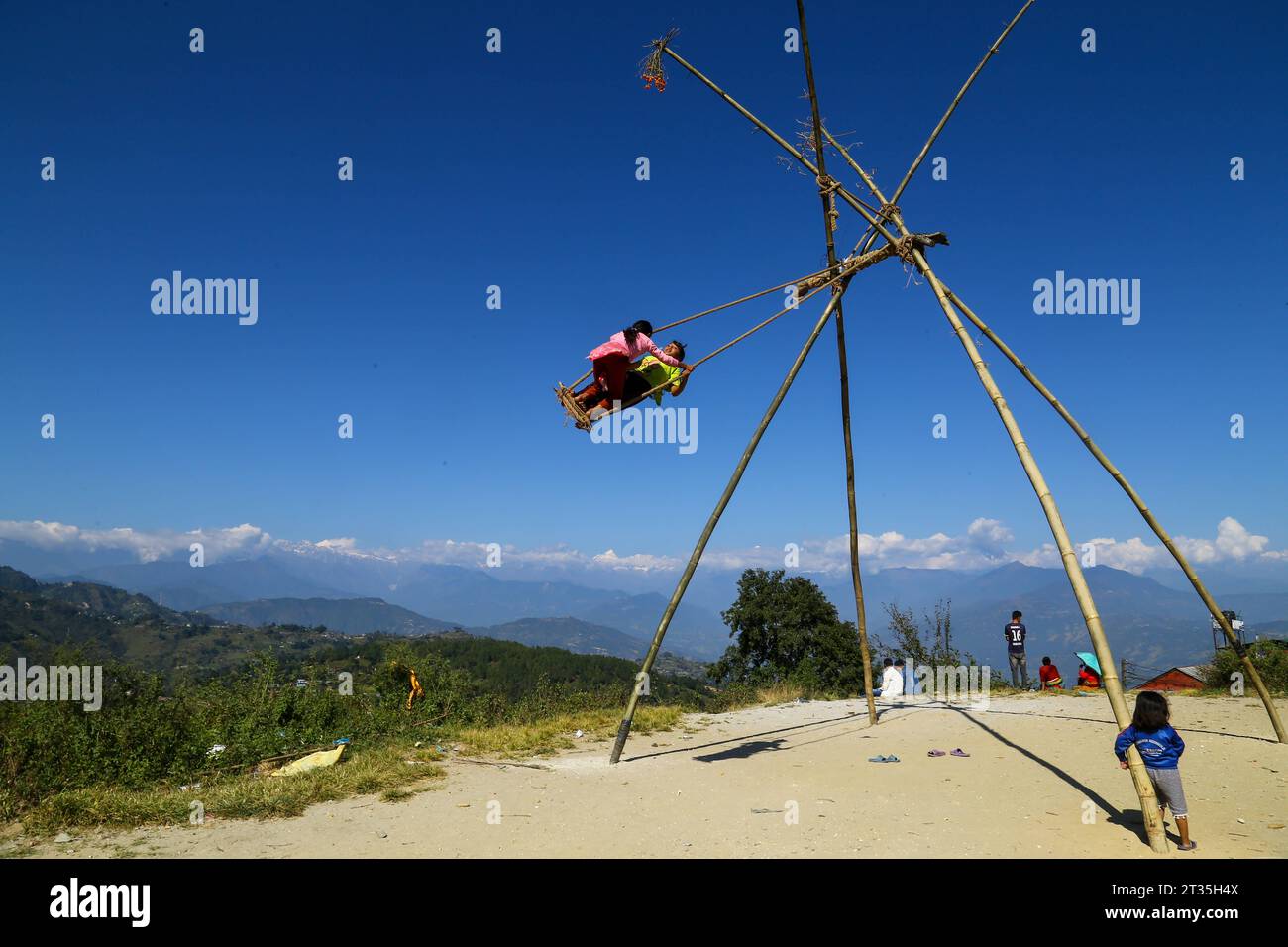 Nepali Hindus play swing as a part of Hindu festival Dashain A pair ...