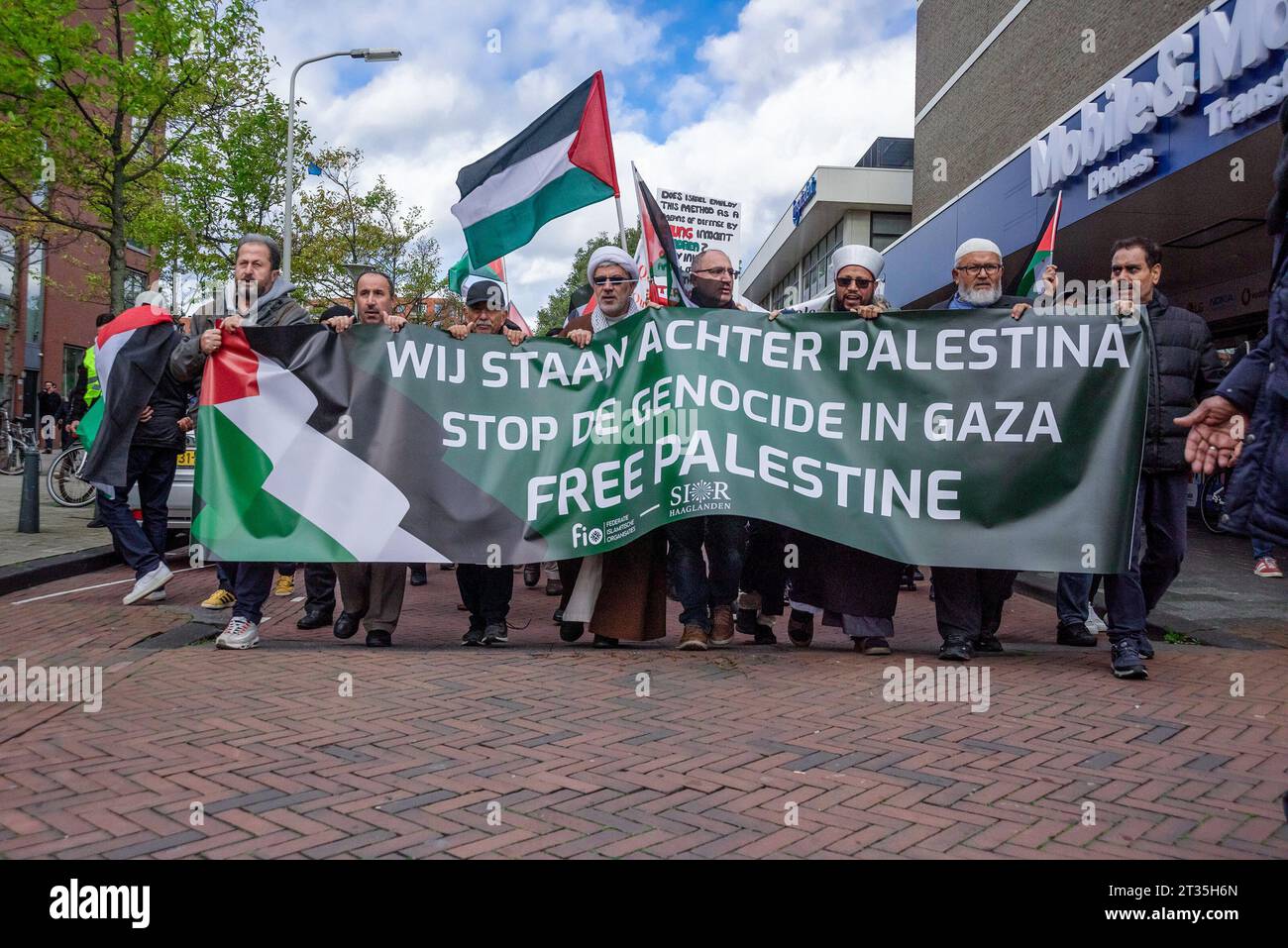 Protesters march with a banner expressing their opinion during a ...