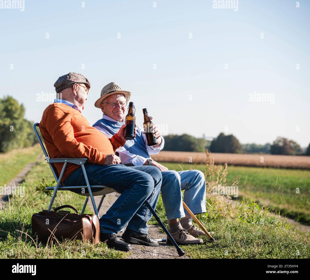 Two old friends sitting fields hi-res stock photography and images - Alamy
