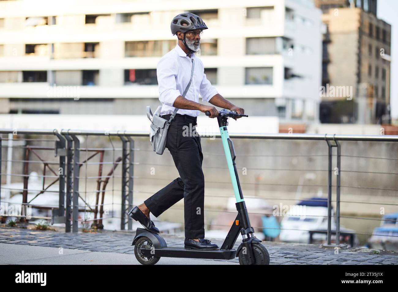 African businessman riding scooter hi-res stock photography and images ...