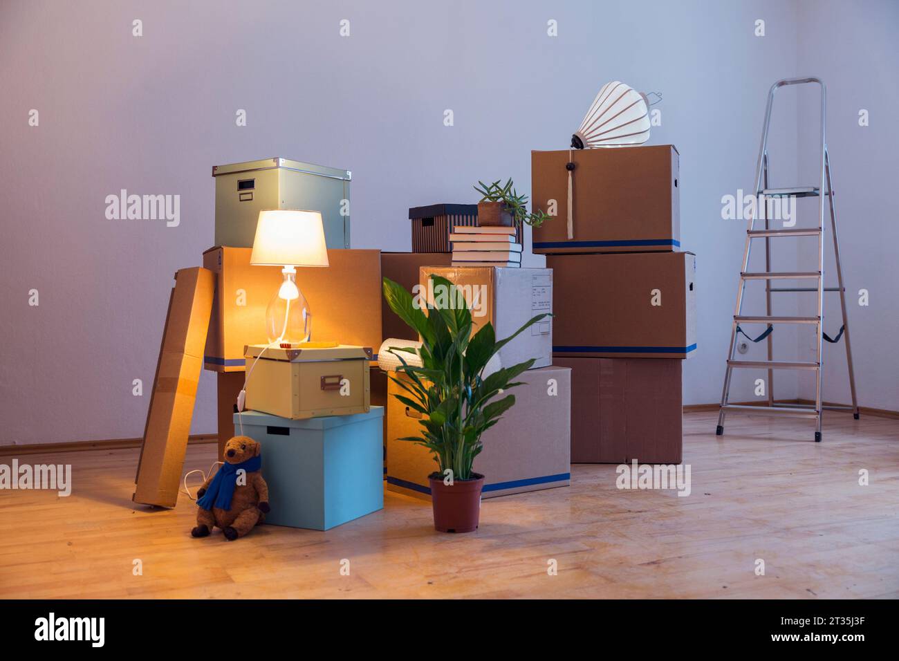 Cardboard boxes in an empty room in a new home Stock Photo - Alamy