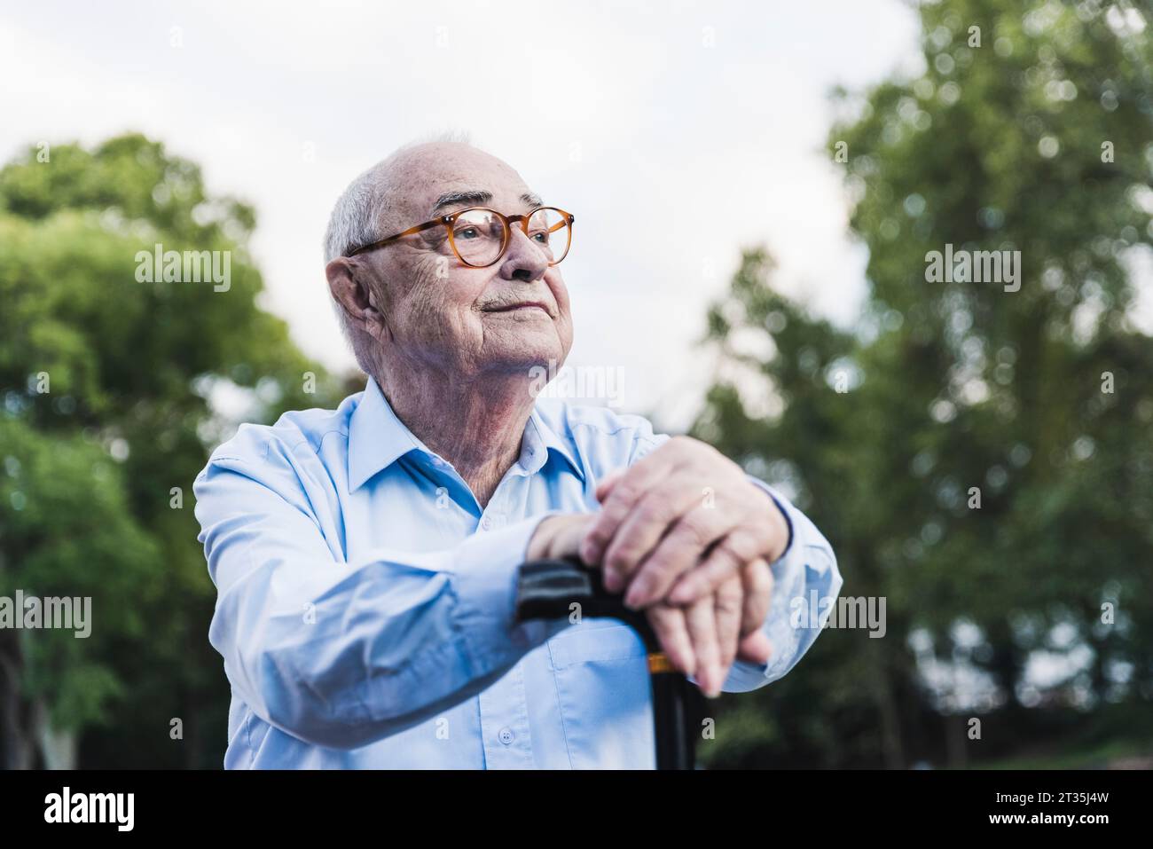Leaning on walking stick hi-res stock photography and images - Alamy
