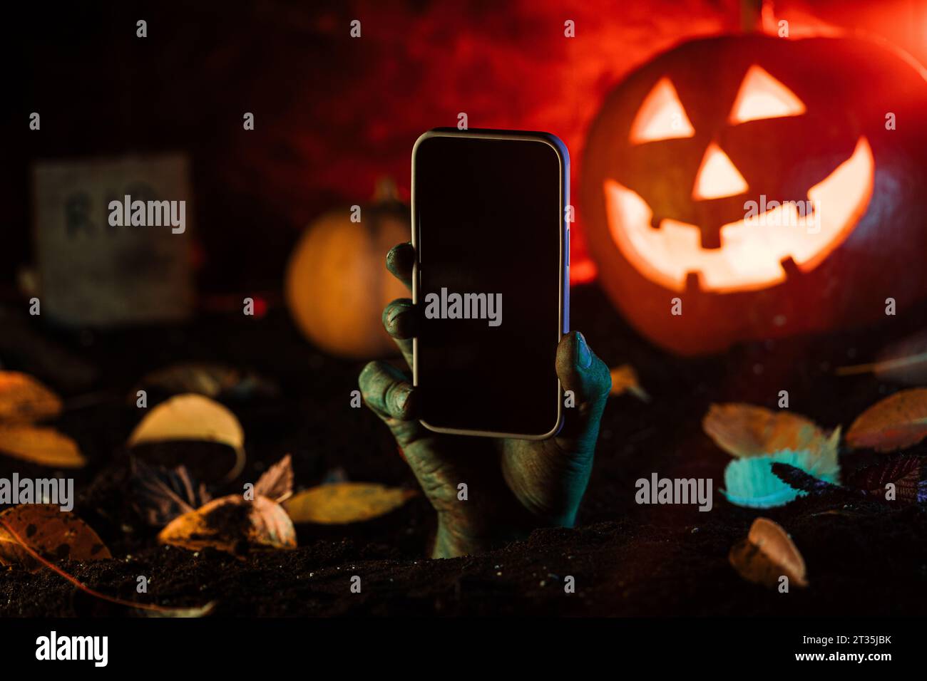 Zombie hand with smartphone.Undead,halloween pumpkin,mobile operator ...