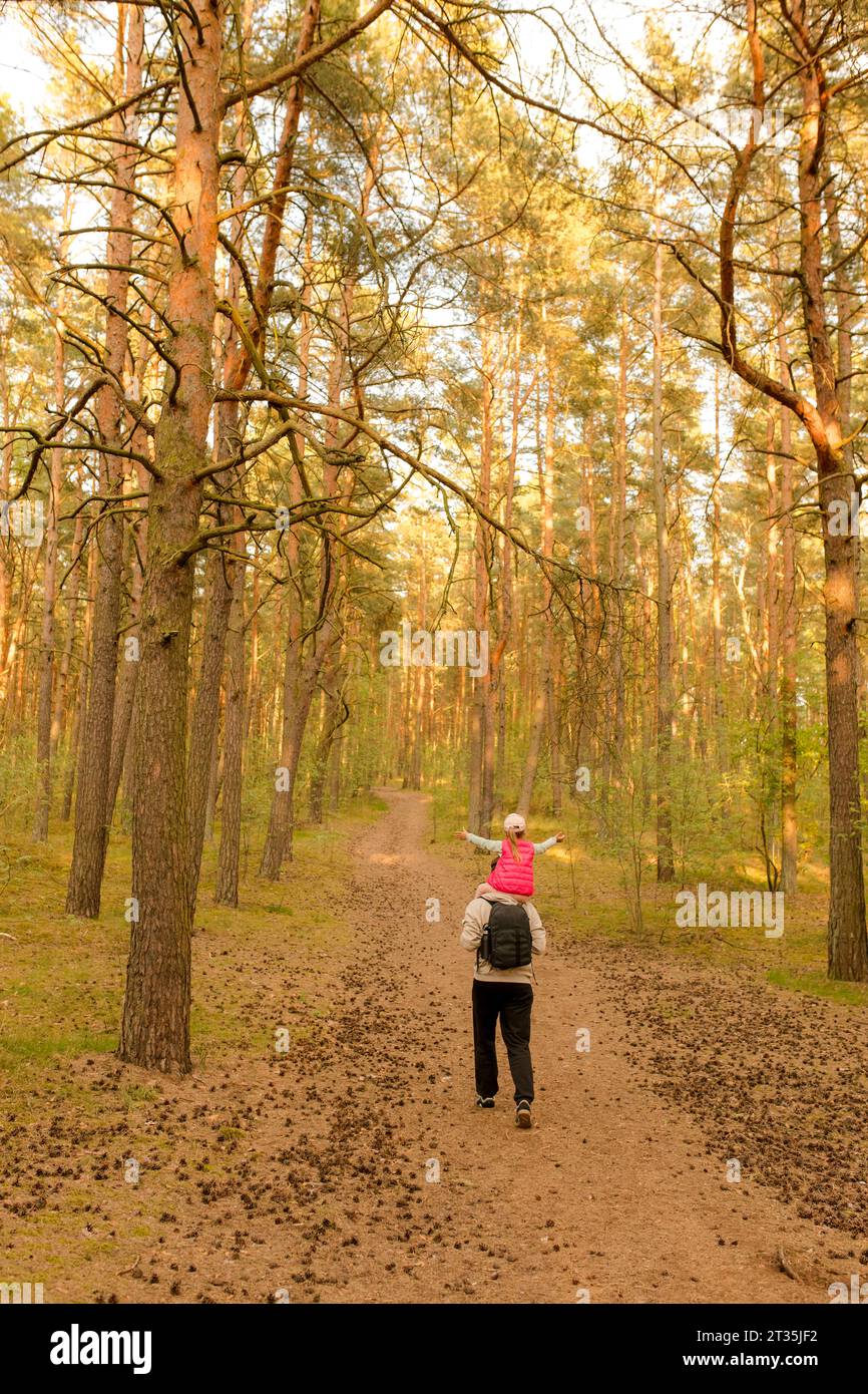 Father and daughter exploring forest Stock Photo - Alamy