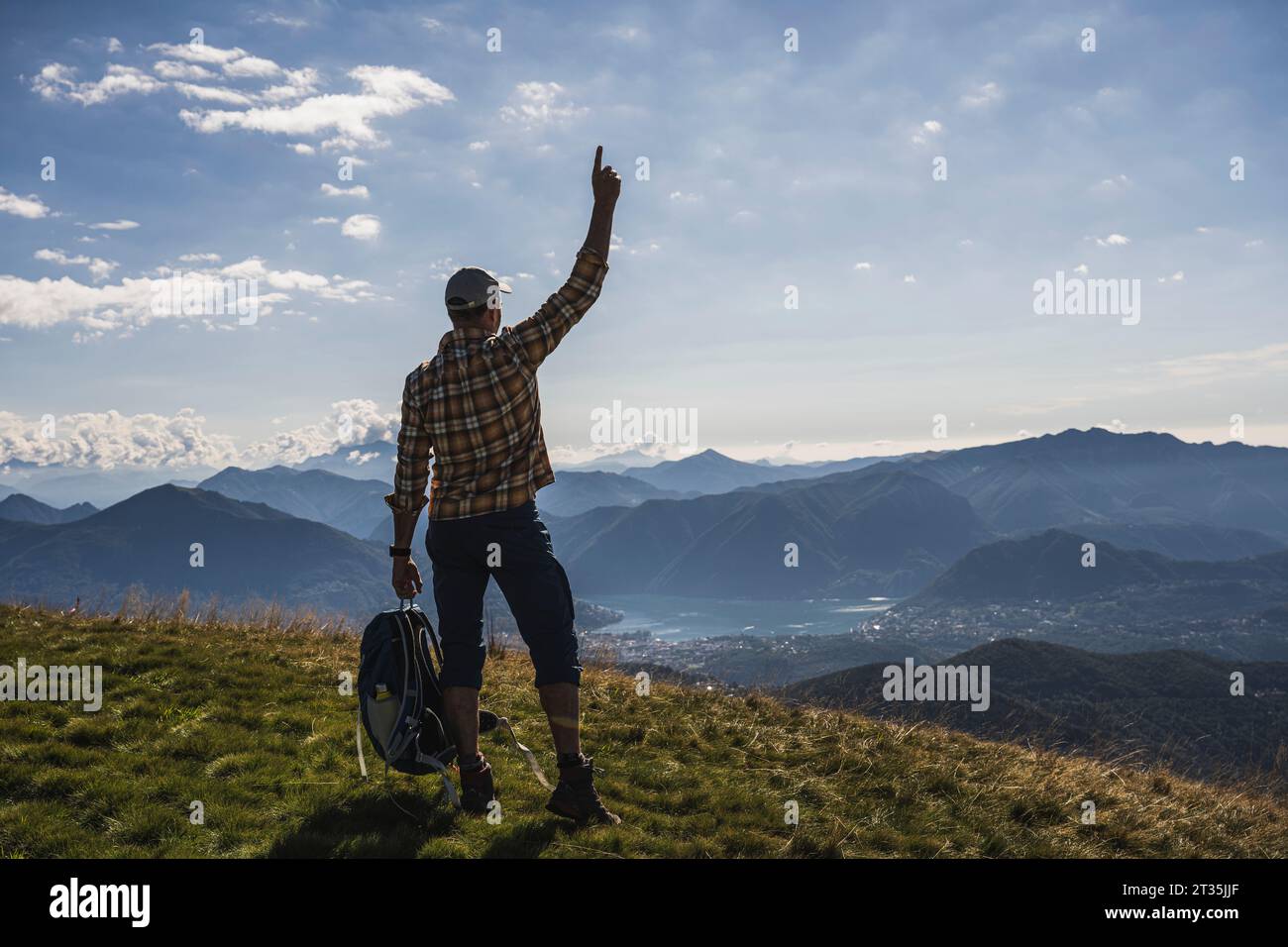Hiker hand pointing mountain hi-res stock photography and images - Alamy