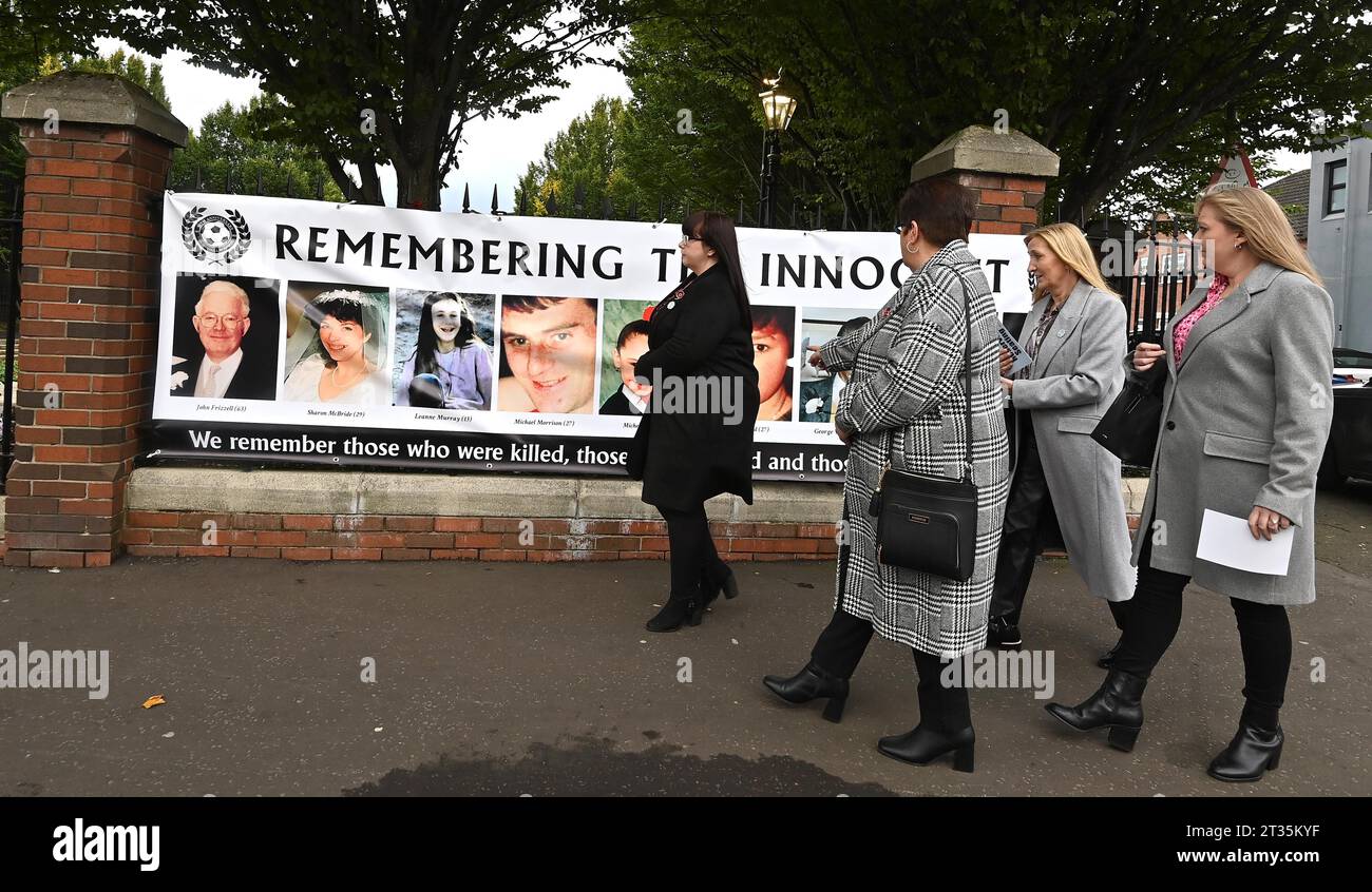 Families and friends of victims walk to the unveiling and dedication on ...