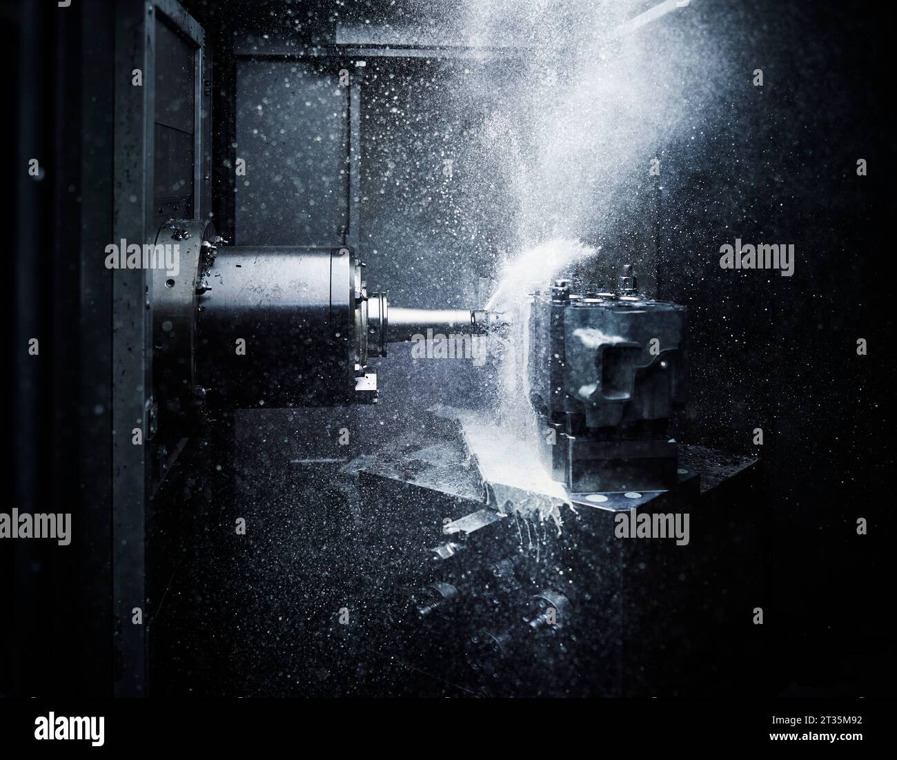 Automated CNC Machine cutting metal in factory Stock Photo - Alamy