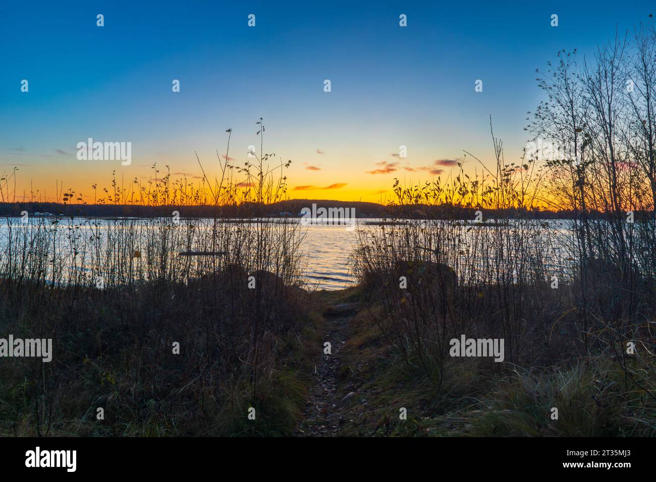 Clear skies over lake Stock Photo - Alamy