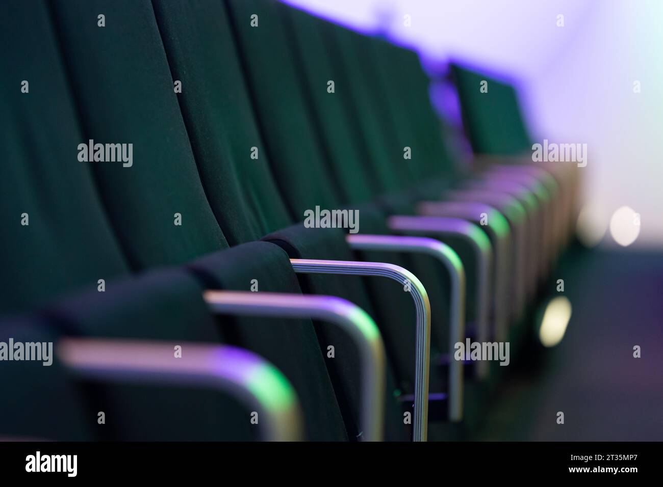 Empty green seats in a row Stock Photo - Alamy