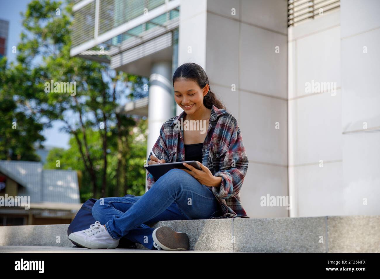 Happy university student using hi-res stock photography and images - Alamy
