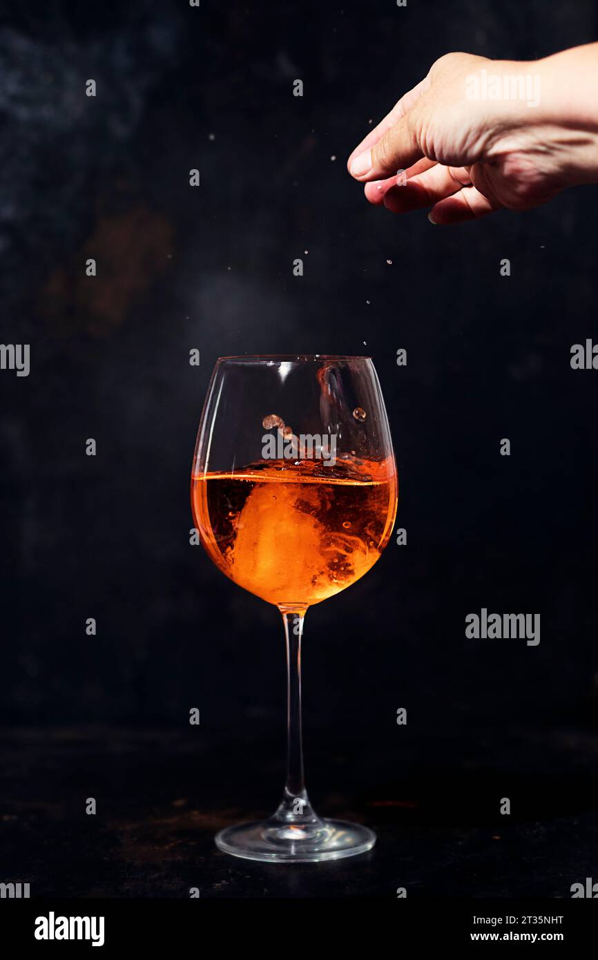 Woman adding ice cubes hi-res stock photography and images - Alamy