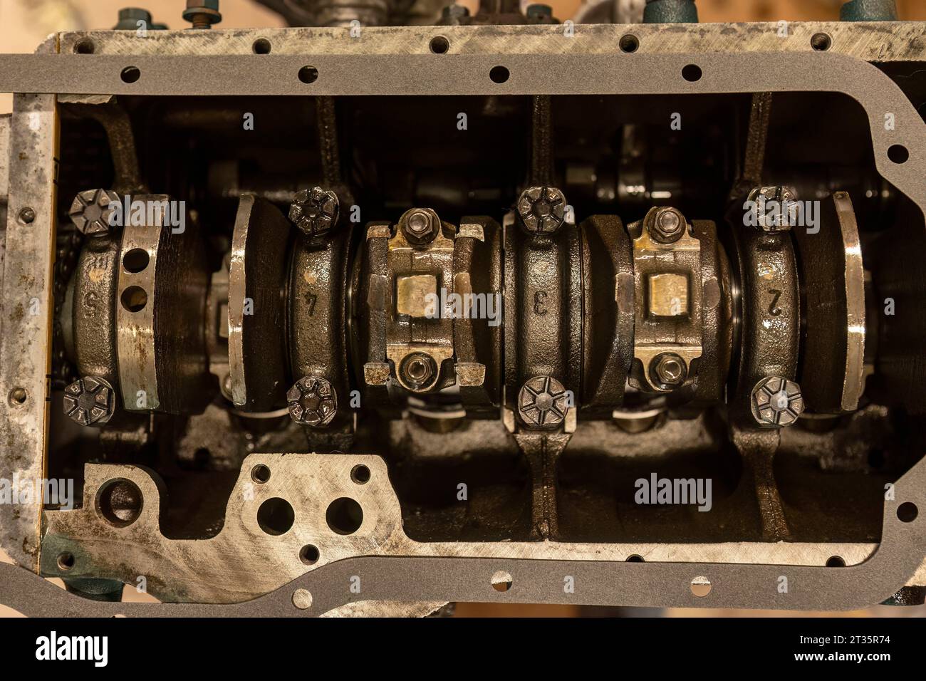 Close-up detailing the intricate process of restoring a vintage engine ...