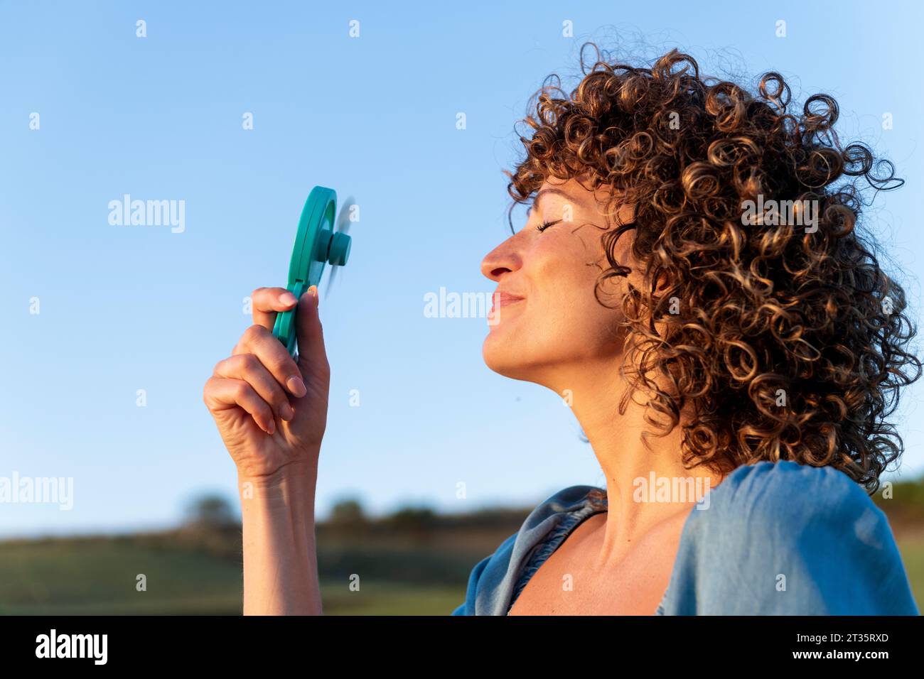 Woman hand fan on hi-res stock photography and images - Alamy