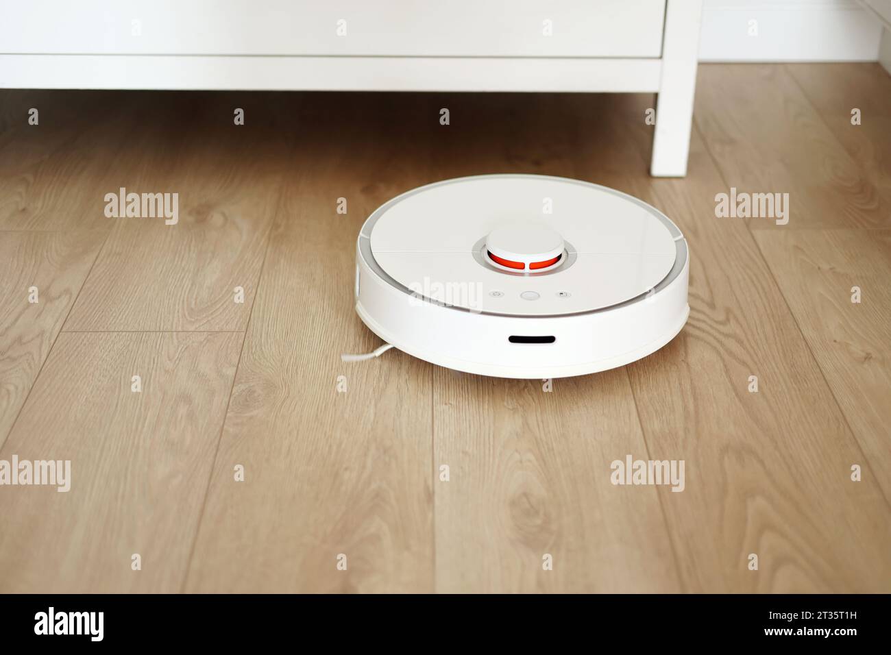 Wireless autonomous robotic vacuum cleaner vacuums with brushes under ...