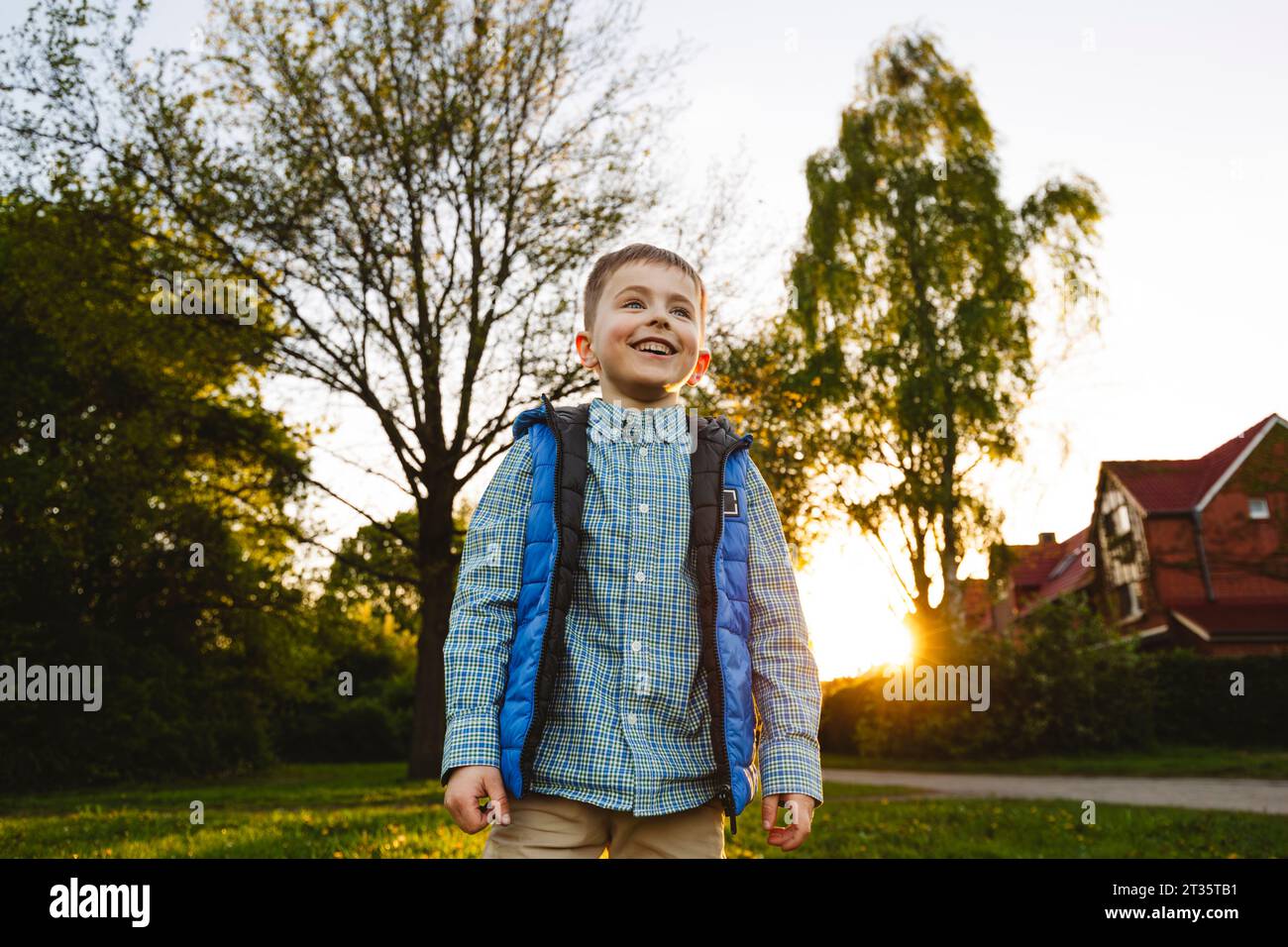 Boy standing in front house hi-res stock photography and images - Alamy