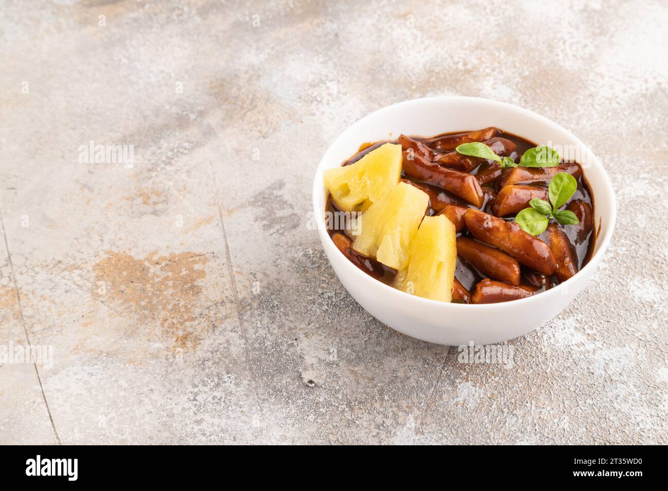 Tteokbokki or Topokki, fried rice cake stick, popular Korean street ...