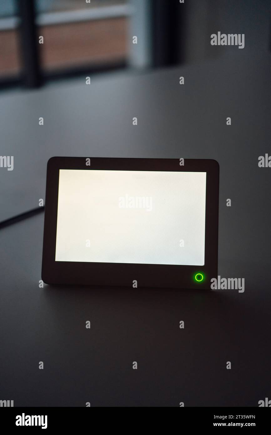 Tablet PC with blank screen at desk in office Stock Photo - Alamy