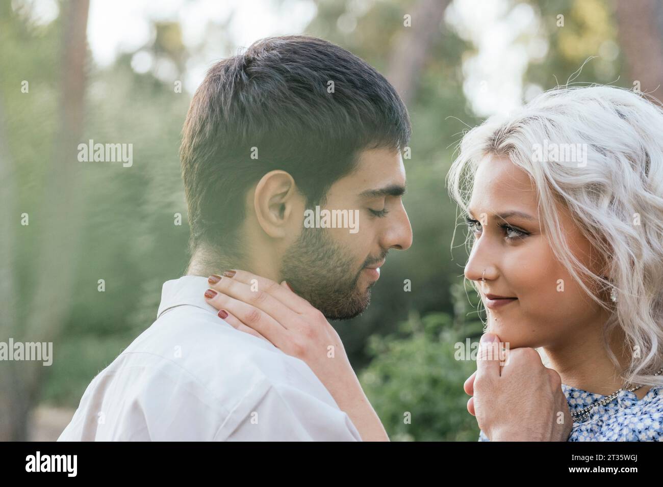 Woman touching boyfriend face with hand hi-res stock photography and ...