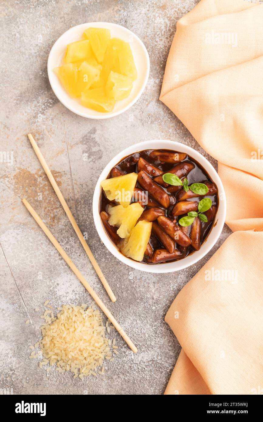 Tteokbokki or Topokki, fried rice cake stick, popular Korean street ...