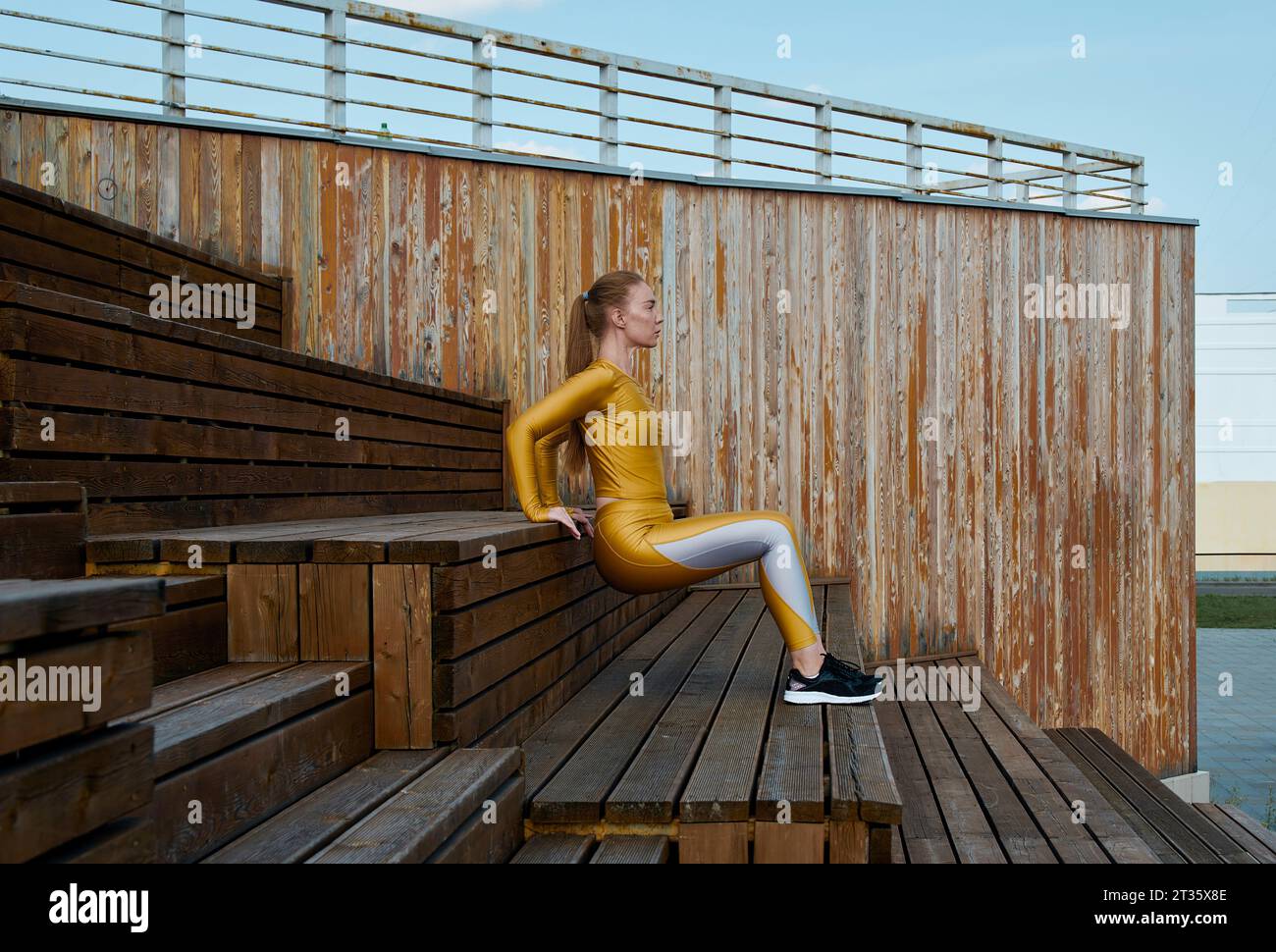Active woman practicing exercise on staircase Stock Photo - Alamy