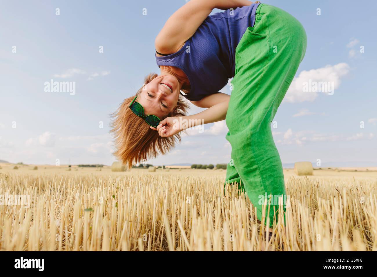 Side view woman bending forward hi-res stock photography and images - Alamy
