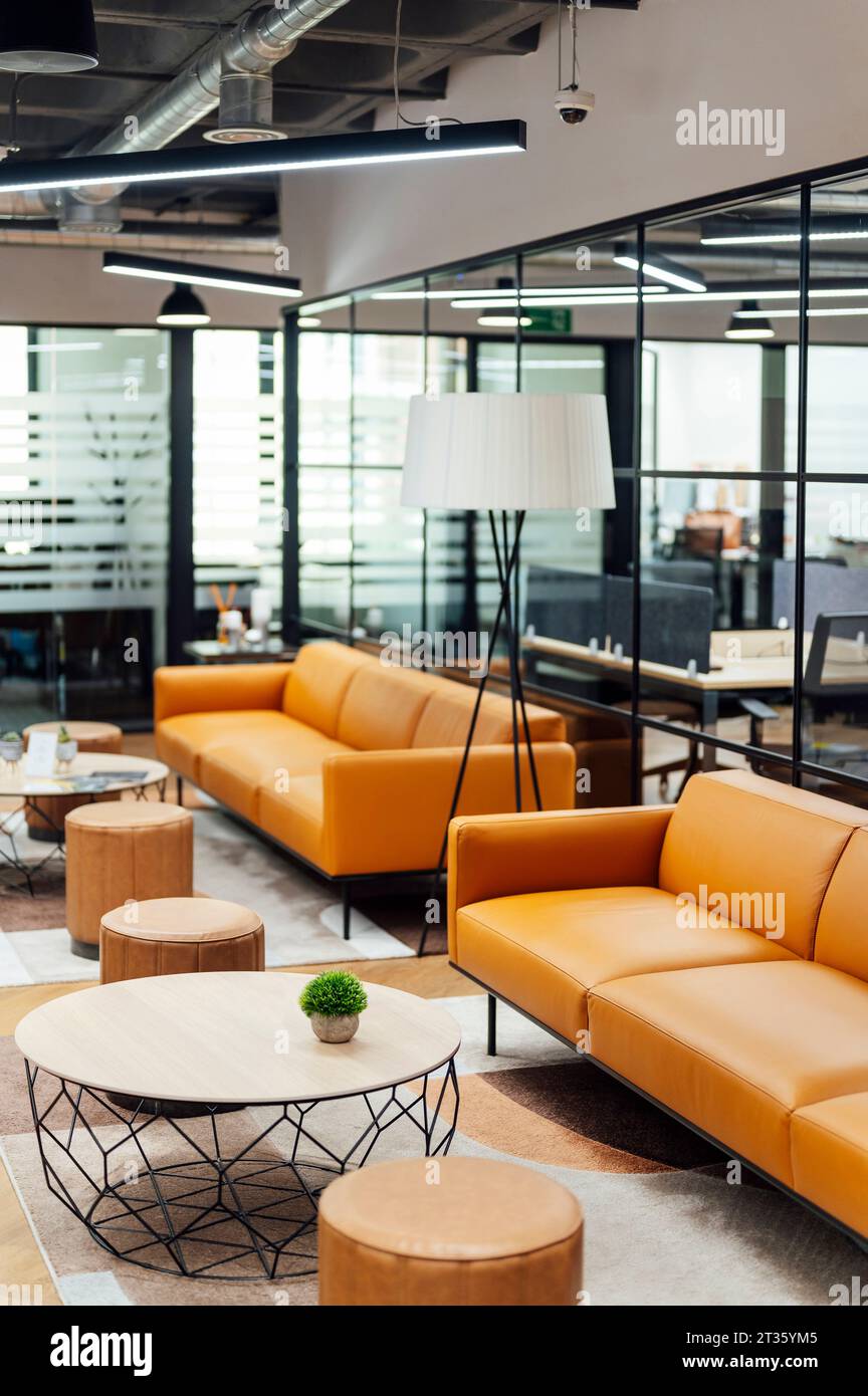 Coffee tables and furniture at modern workplace Stock Photo - Alamy