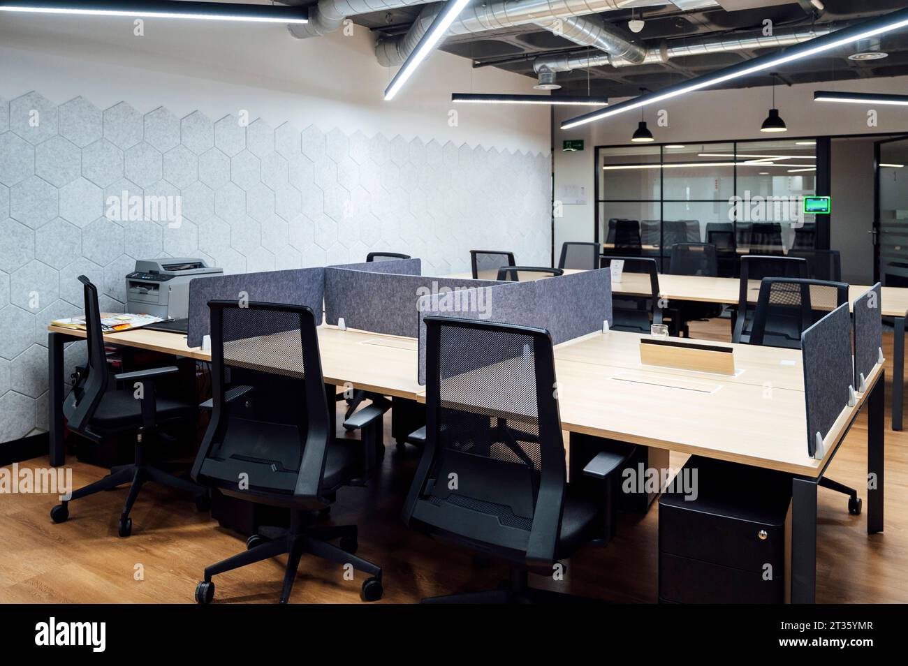 Chairs and desk arranged in modern office Stock Photo - Alamy