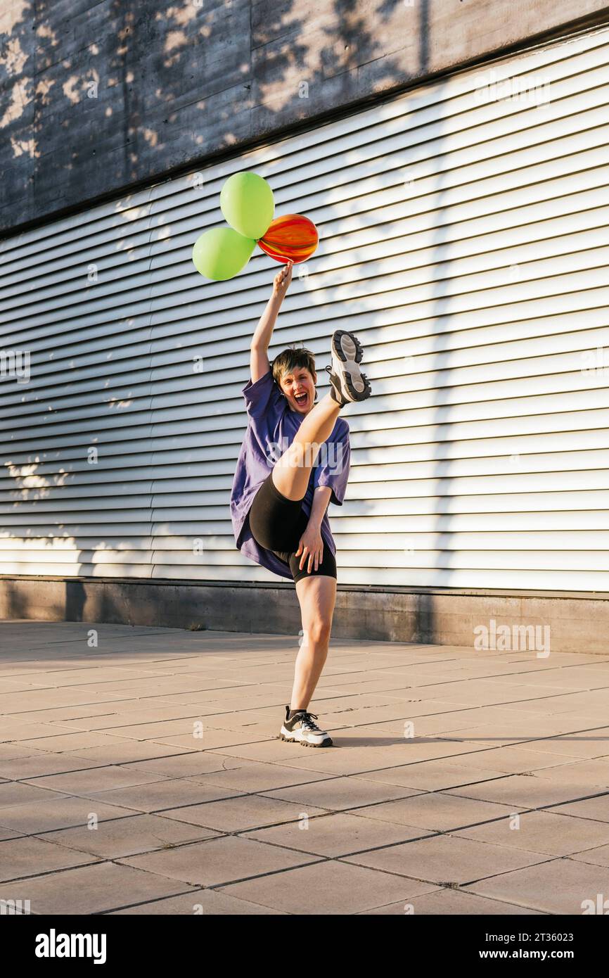 Holding balloons on one leg hi-res stock photography and images - Alamy