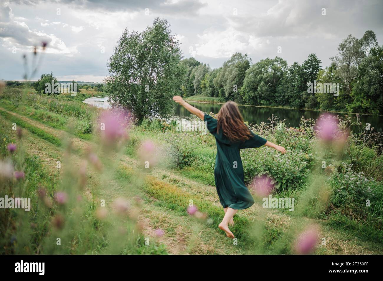 Woman dancing with long dress hi-res stock photography and images - Alamy