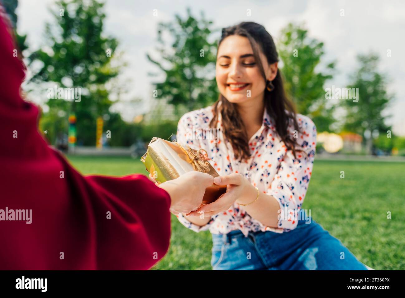 Woman taking gift from hi-res stock photography and images - Alamy