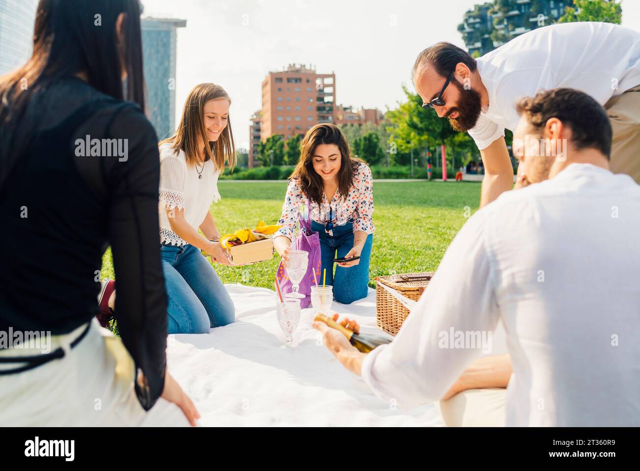 Multicultural friends enjoying carefree picnic hi-res stock photography and images - Alamy