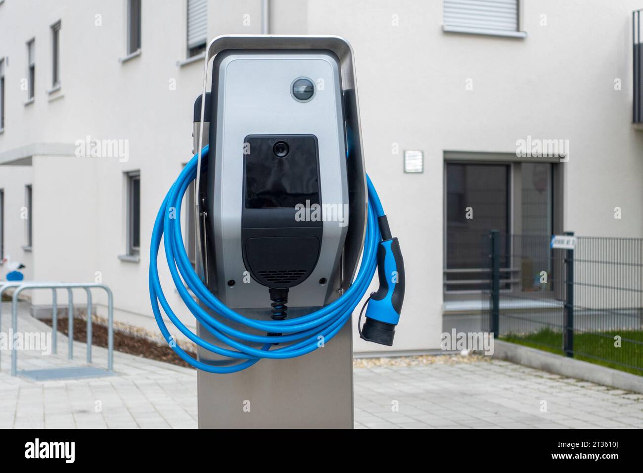 Electric vehicle charging station in front of house Stock Photo - Alamy