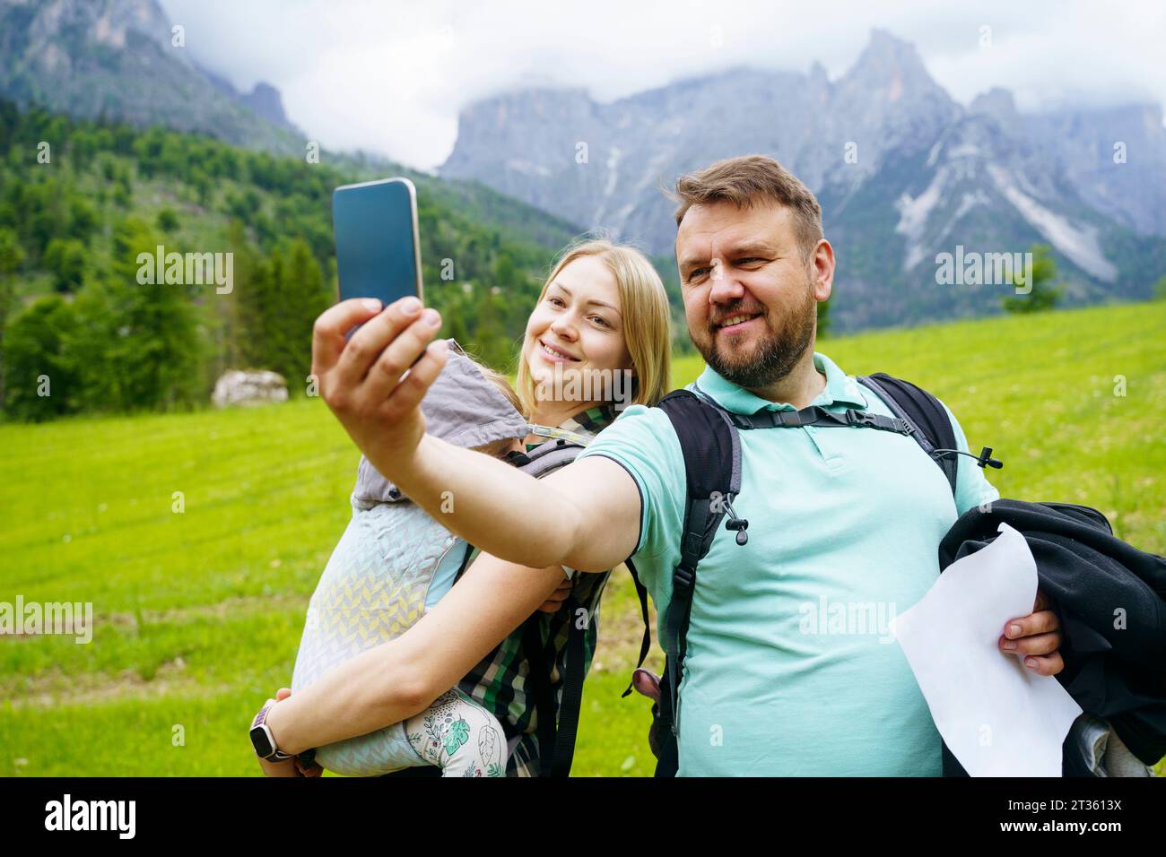 Parents taking selfie with daughter through smart phone Stock Photo - Alamy