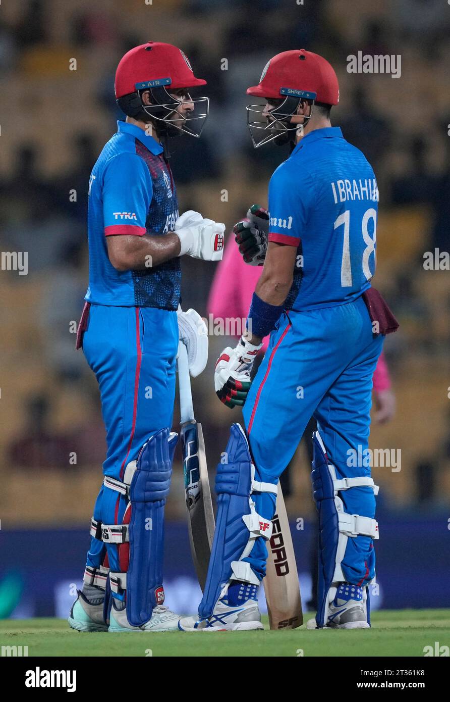 Afghanistan's Ibrahim Zardan, right, talks to his batting partner ...
