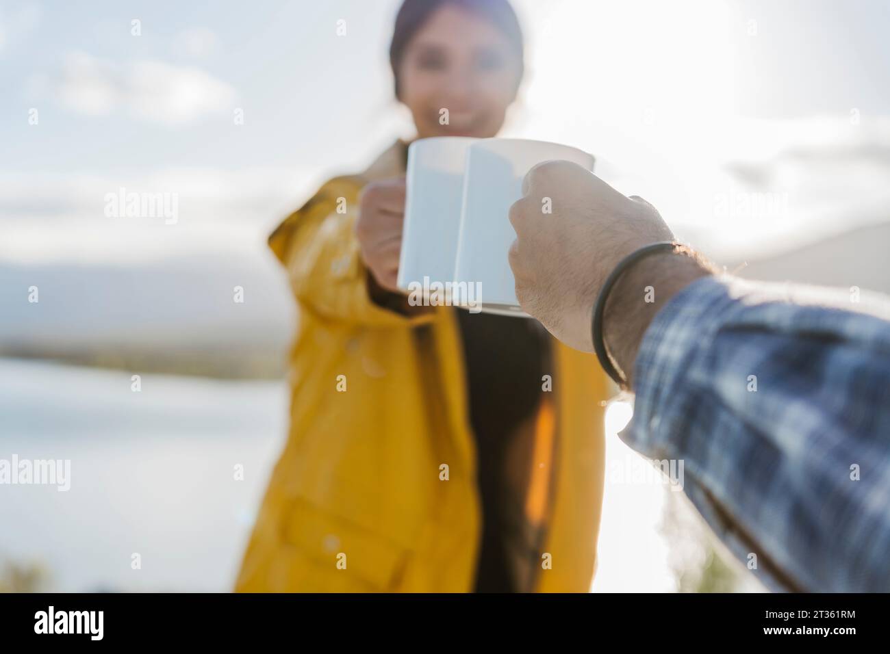 Toasting with cups hi-res stock photography and images - Alamy
