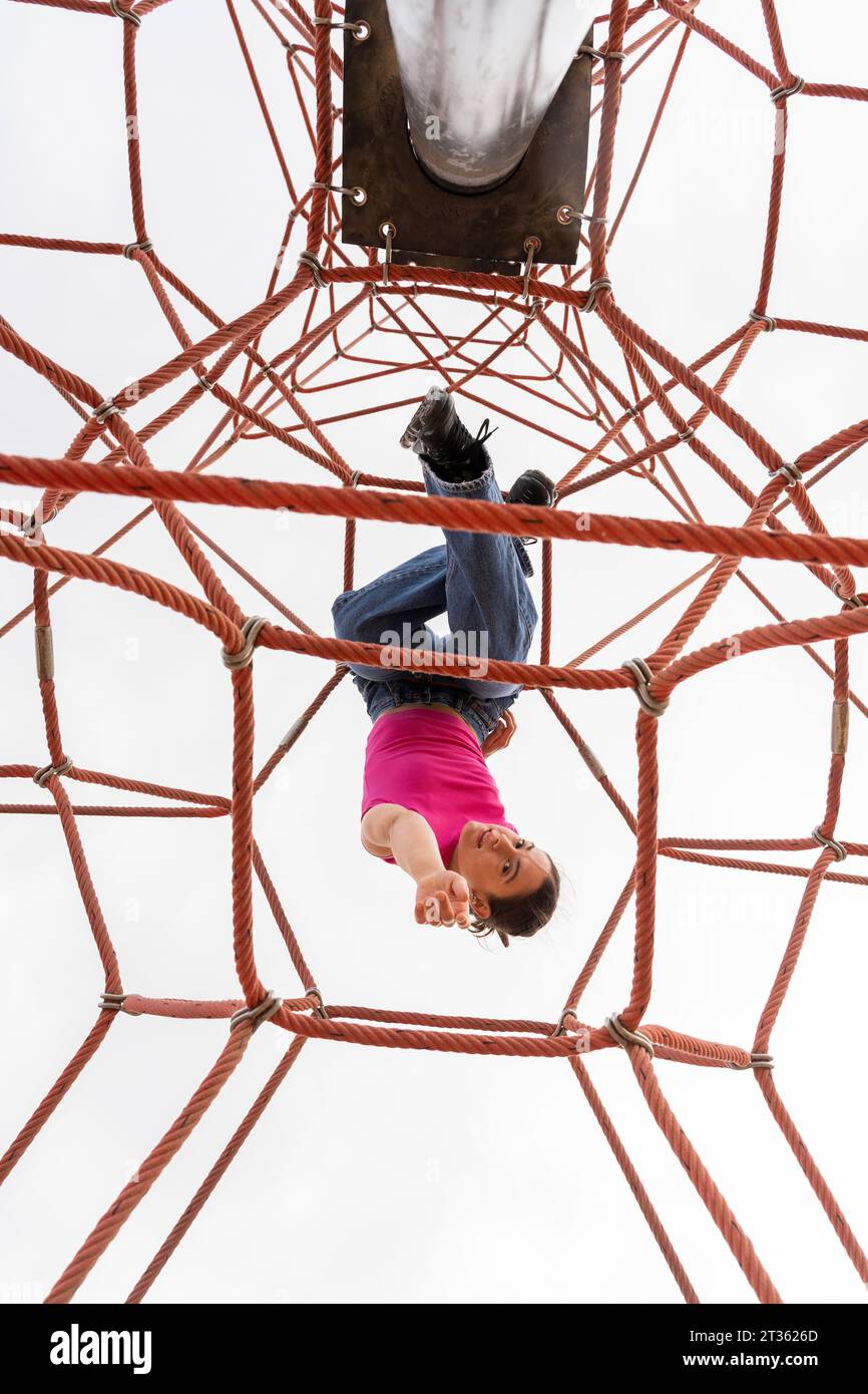 Hanging on jungle gym hi-res stock photography and images - Alamy