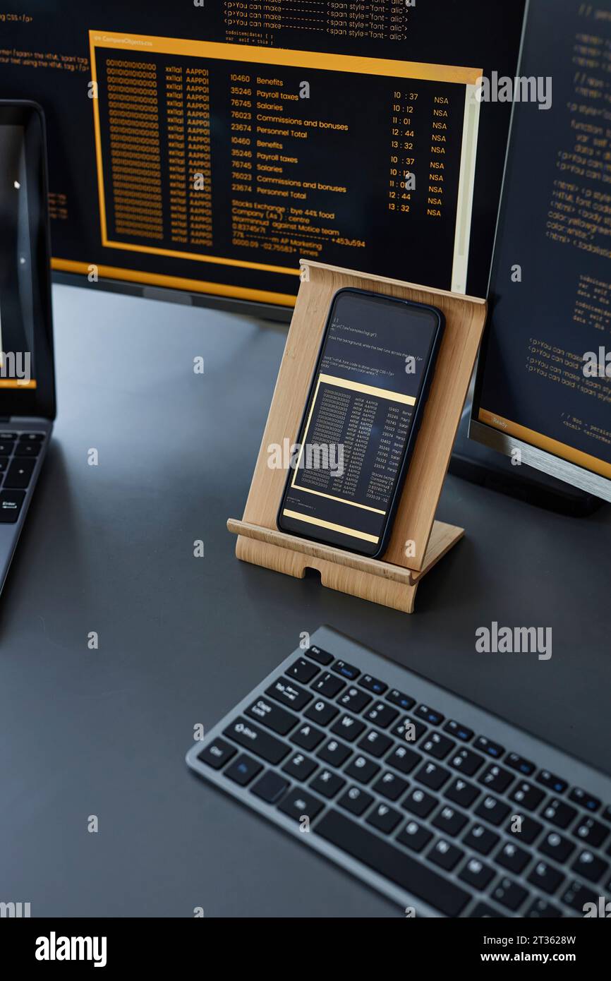 Smart phone with computers on desk Stock Photo - Alamy