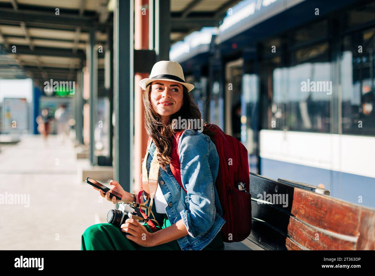 Woman on tram station hi-res stock photography and images - Alamy