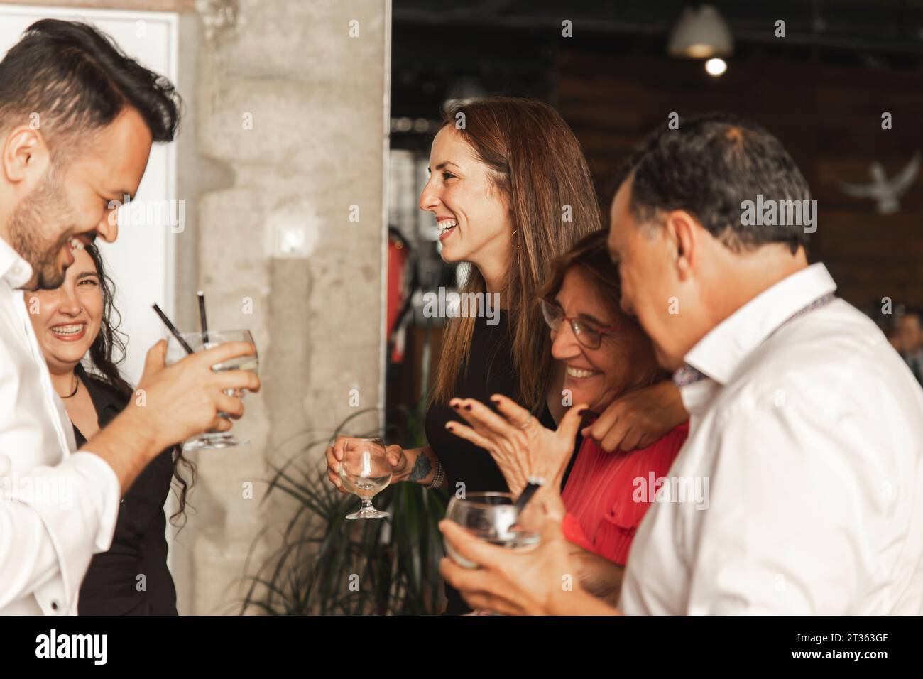 Happy family enjoying with friends at wedding reception Stock Photo - Alamy