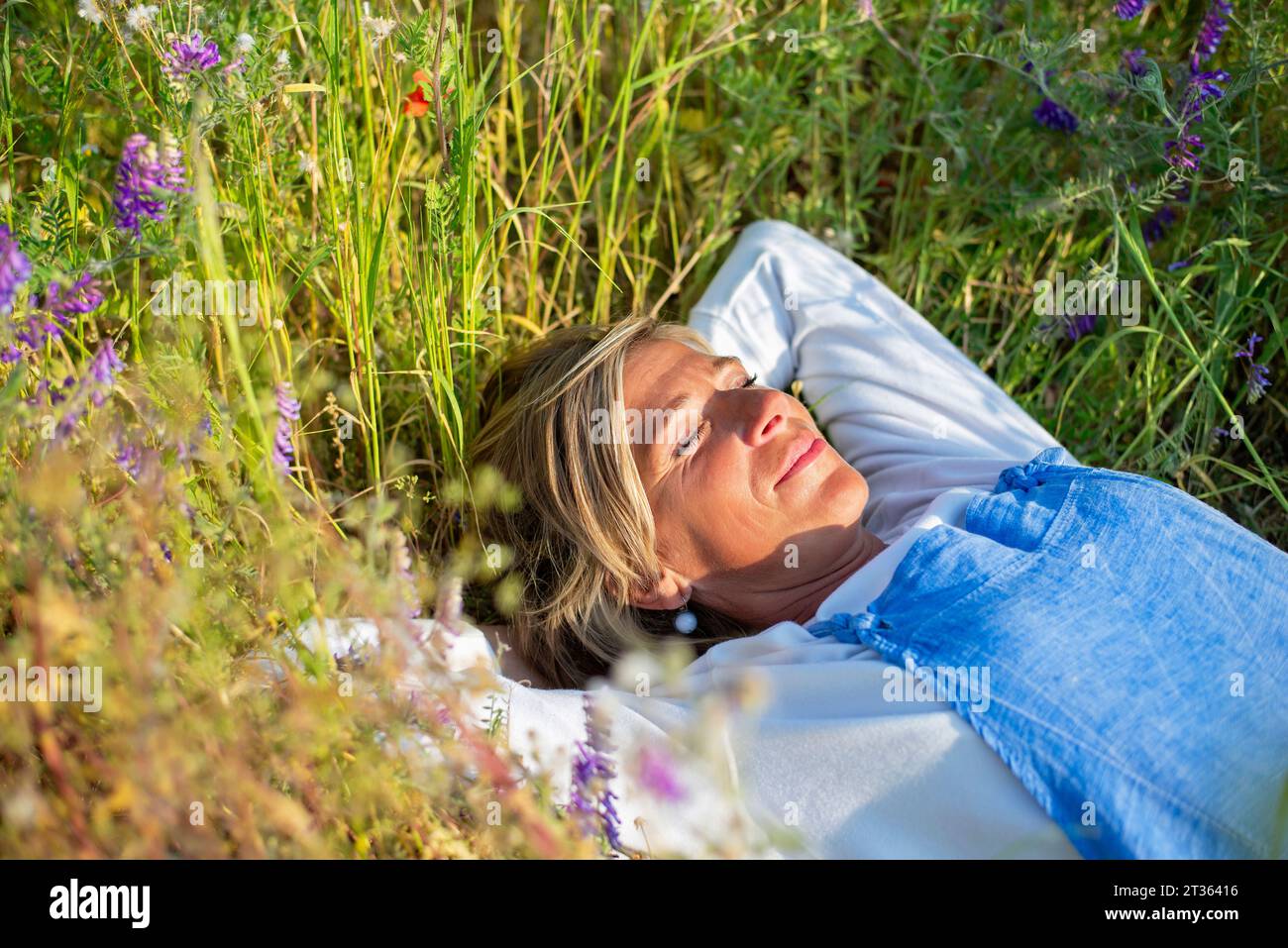 Tired woman relaxing on nature hi-res stock photography and images - Alamy