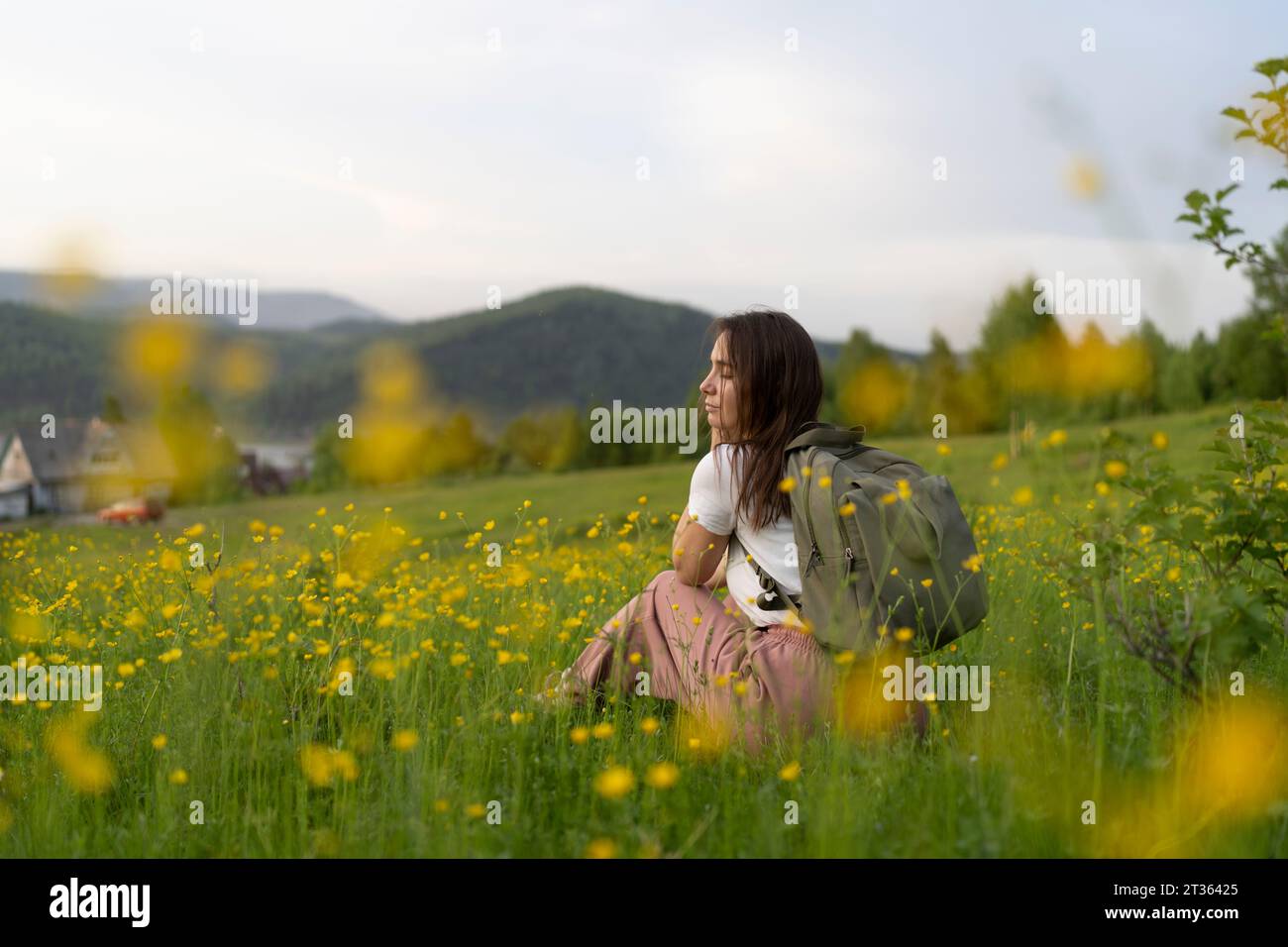 Women sitting in flower field hi-res stock photography and images - Alamy