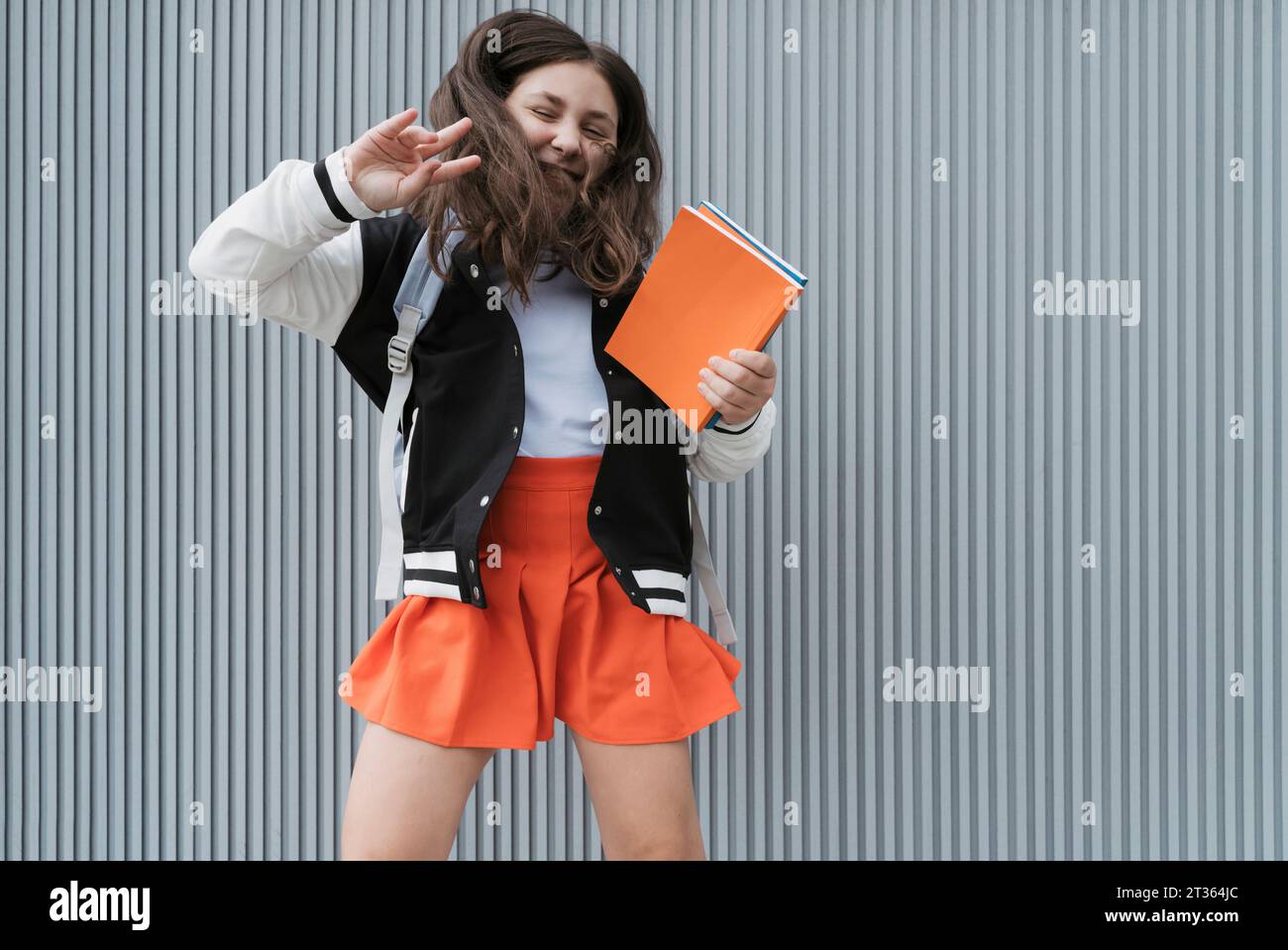 Schoolgirl showing peace sign hi-res stock photography and images - Alamy