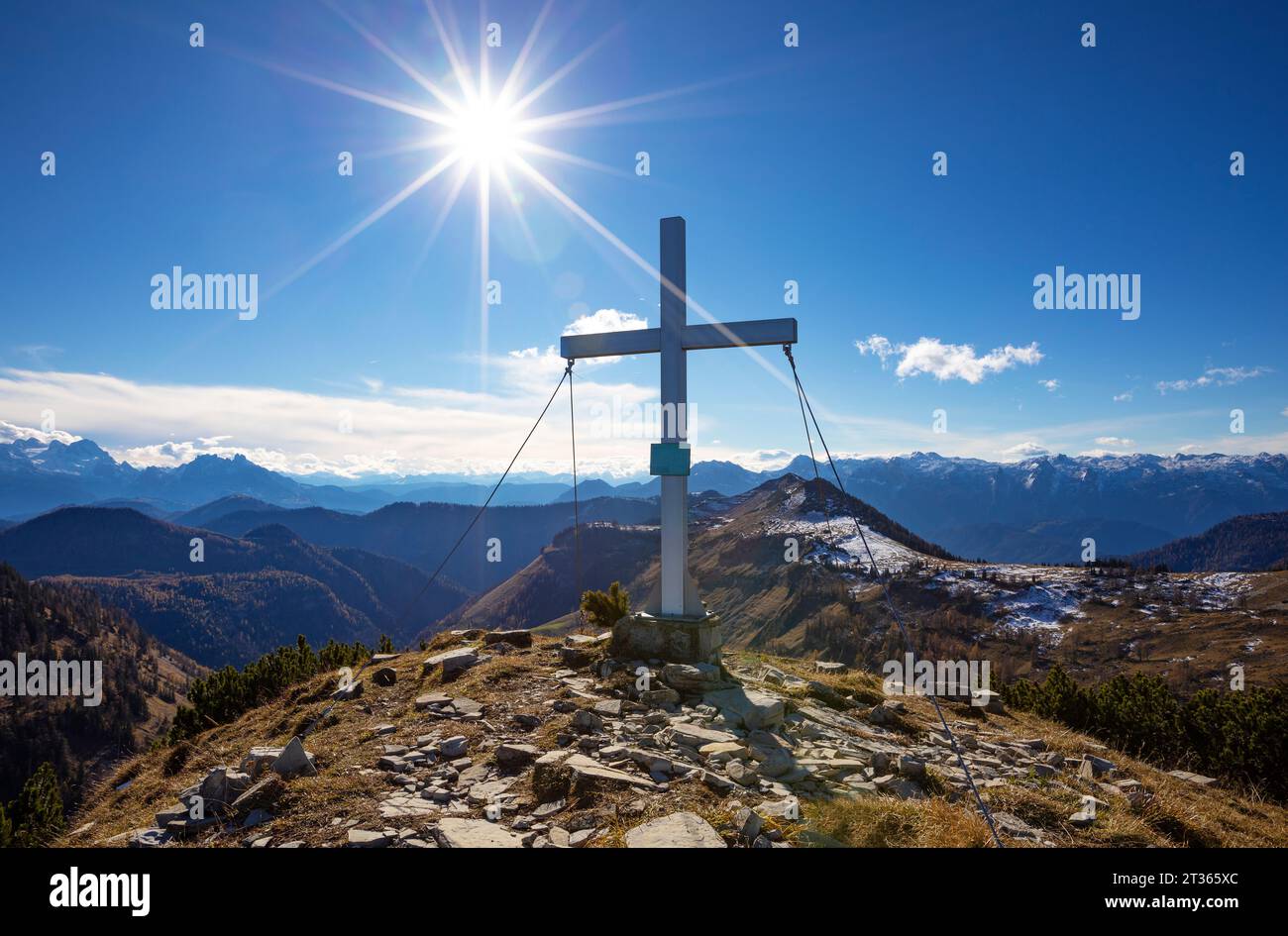 Austria, Salzburger Land, Sun shining over summit cross on Osterhorn ...