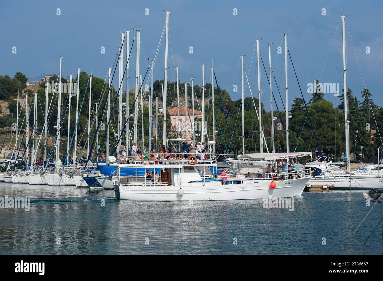 Excursion boat going past the Yacht harbour,Vrsar, Istria, Croatia ...