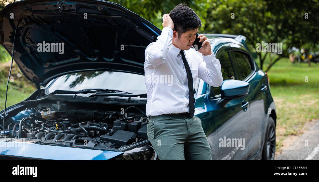 Businessman calling roadside assistance hi-res stock photography and images - Alamy