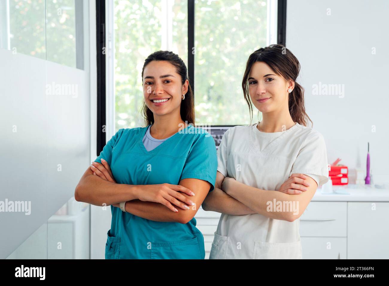 Confident multiracial dentists with arms crossed in clinic Stock Photo ...