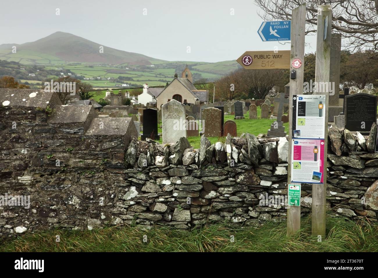 Signs for walking routes at Kirk Maughold Church and graveyard ...