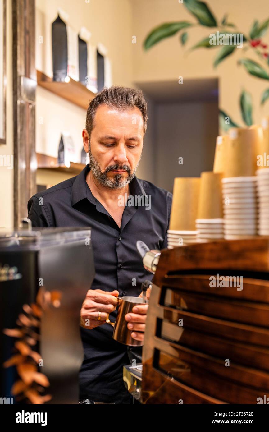 Making coffee in cafe hi-res stock photography and images - Alamy