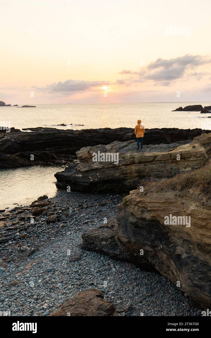 Woman standing under rock hi-res stock photography and images - Alamy